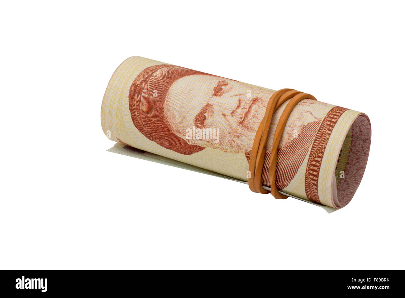 Rolled rial banknotes with a rubber ring, isolated Stock Photo - Alamy