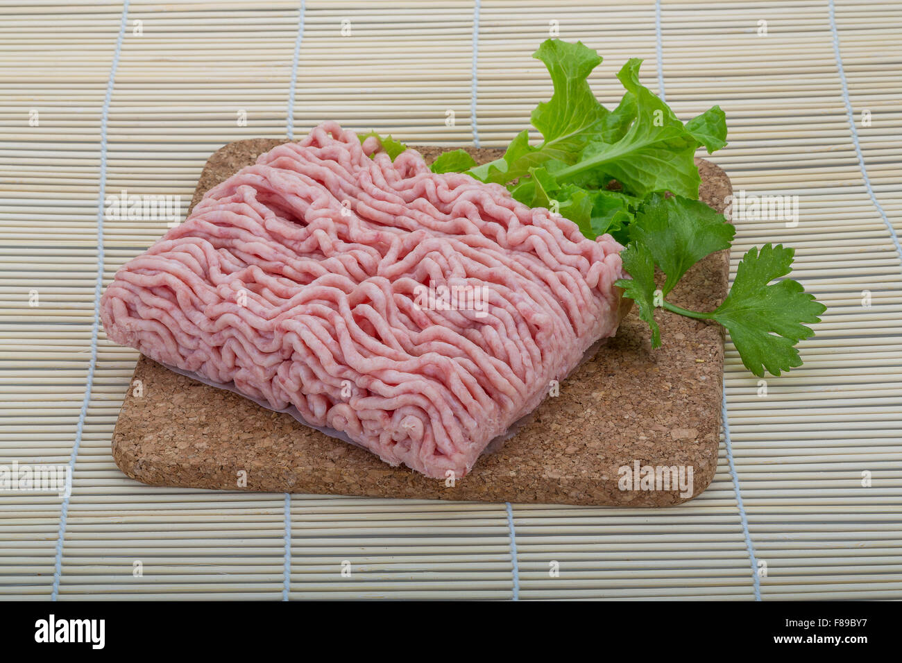 Raw minced pork meat on the desk with herbs Stock Photo - Alamy
