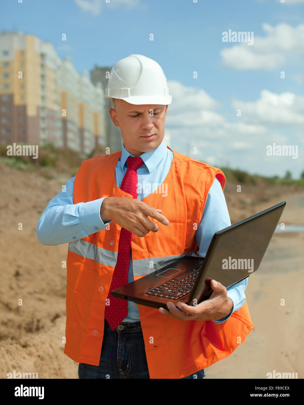 Portrait of builder works at construction site Stock Photo - Alamy