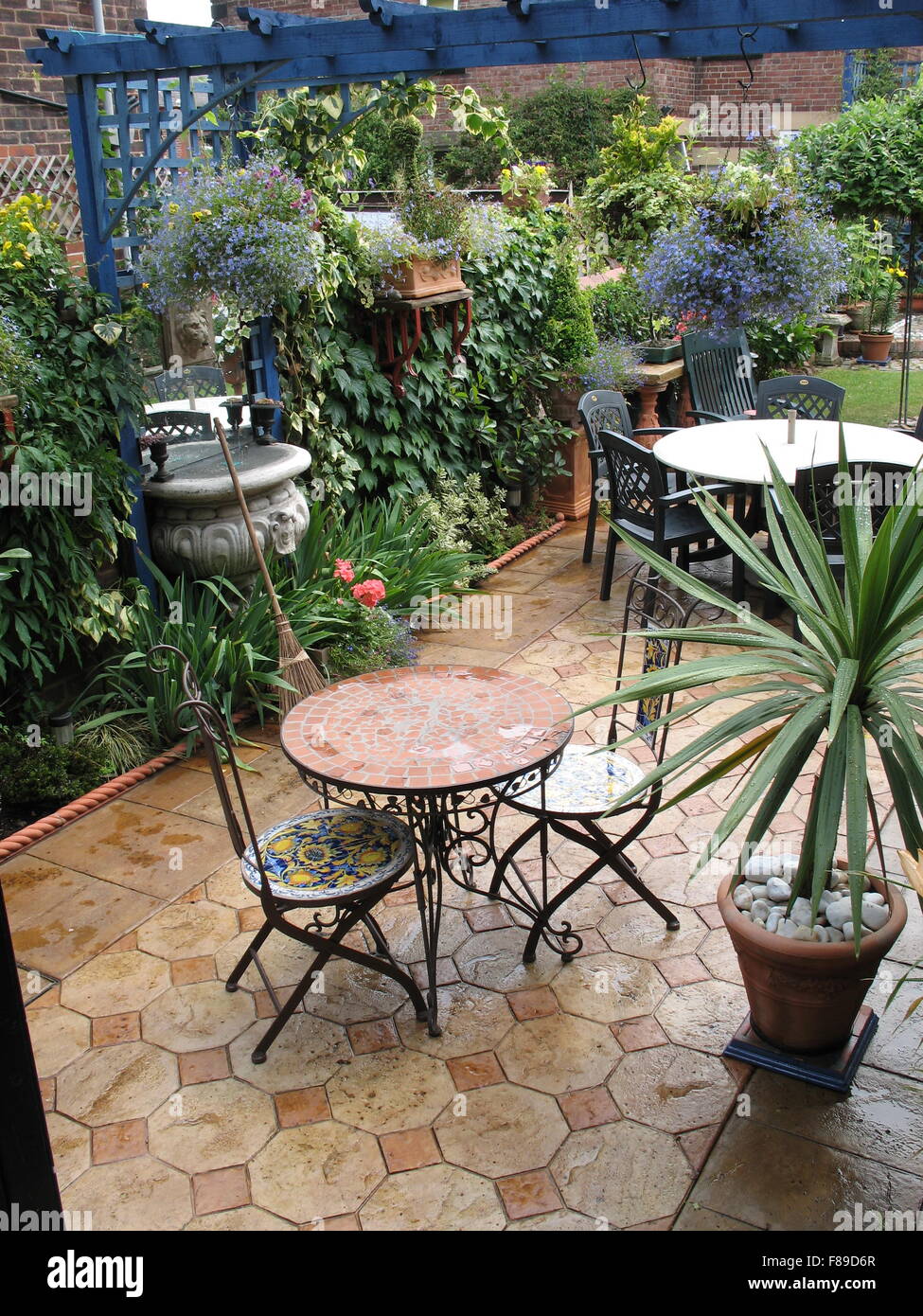 Garden with flagged flooring Stock Photo - Alamy