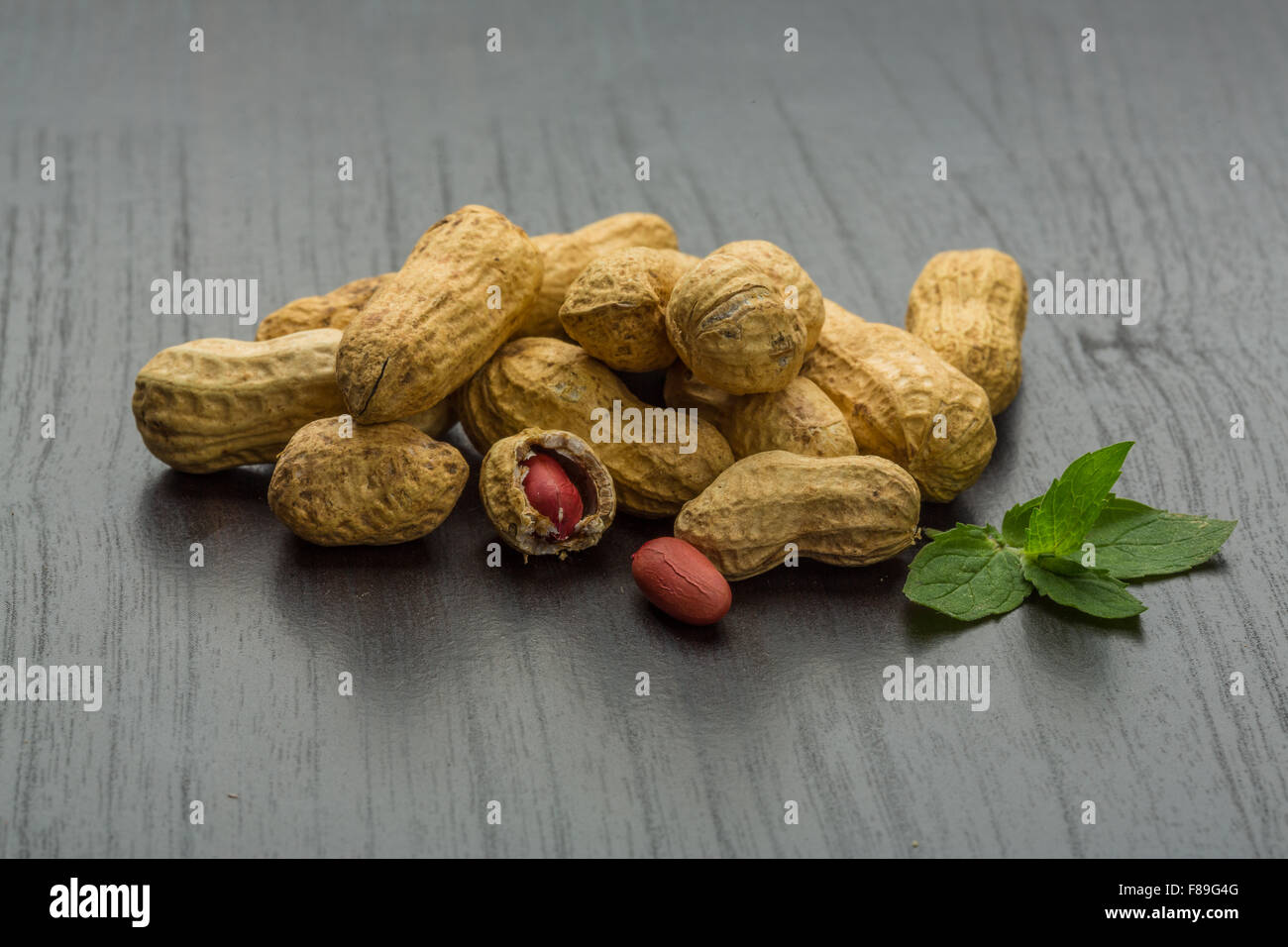 Peanut heap on the desk Stock Photo - Alamy