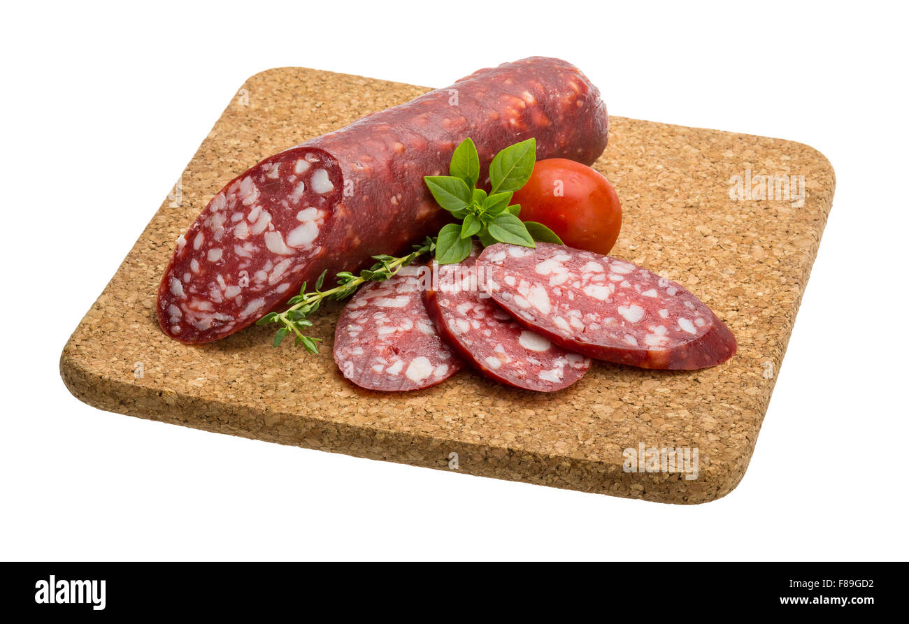 Salami sausages sliced with basil and tomato Stock Photo - Alamy