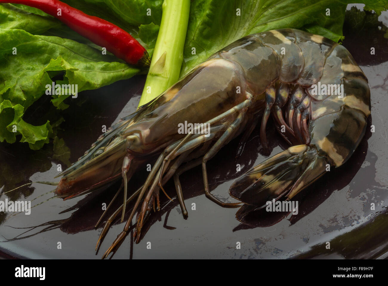 Raw Tiger prawn ready for cooking Stock Photo - Alamy