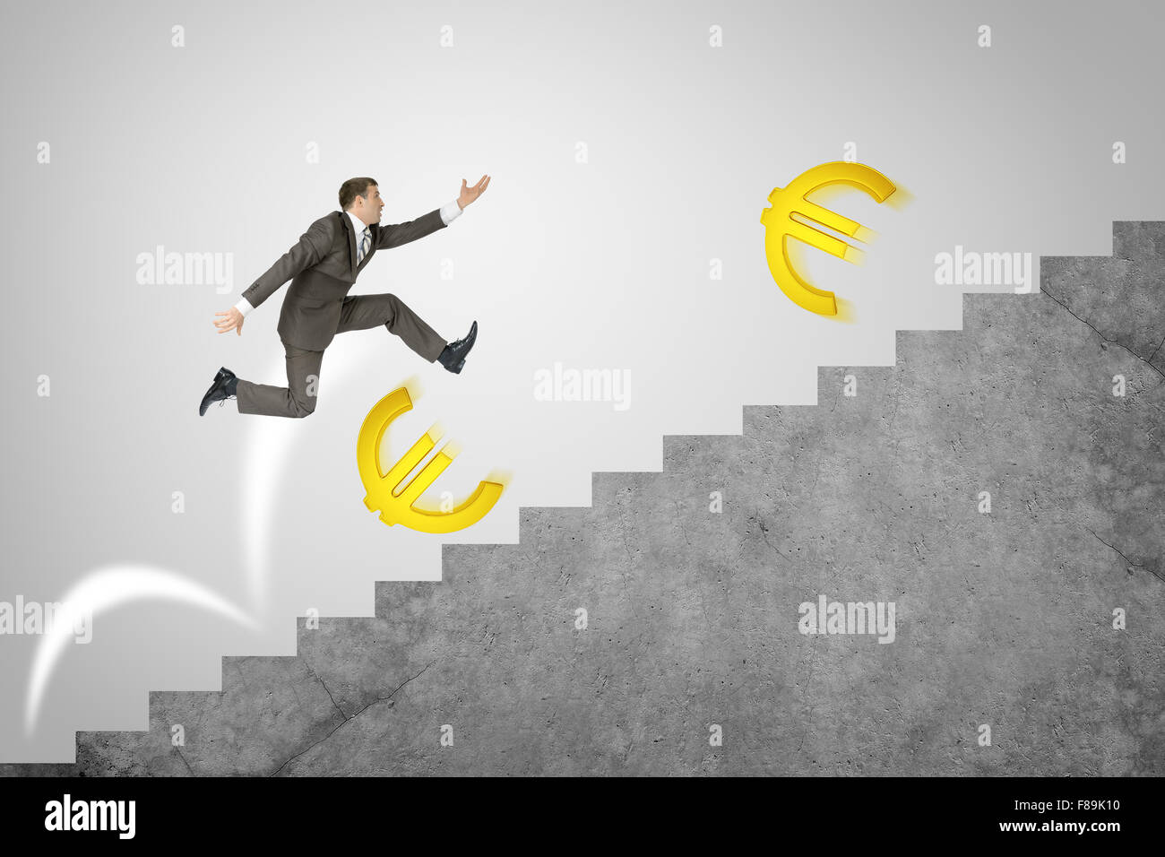 Man running up stairs with gold euro signs Stock Photo - Alamy
