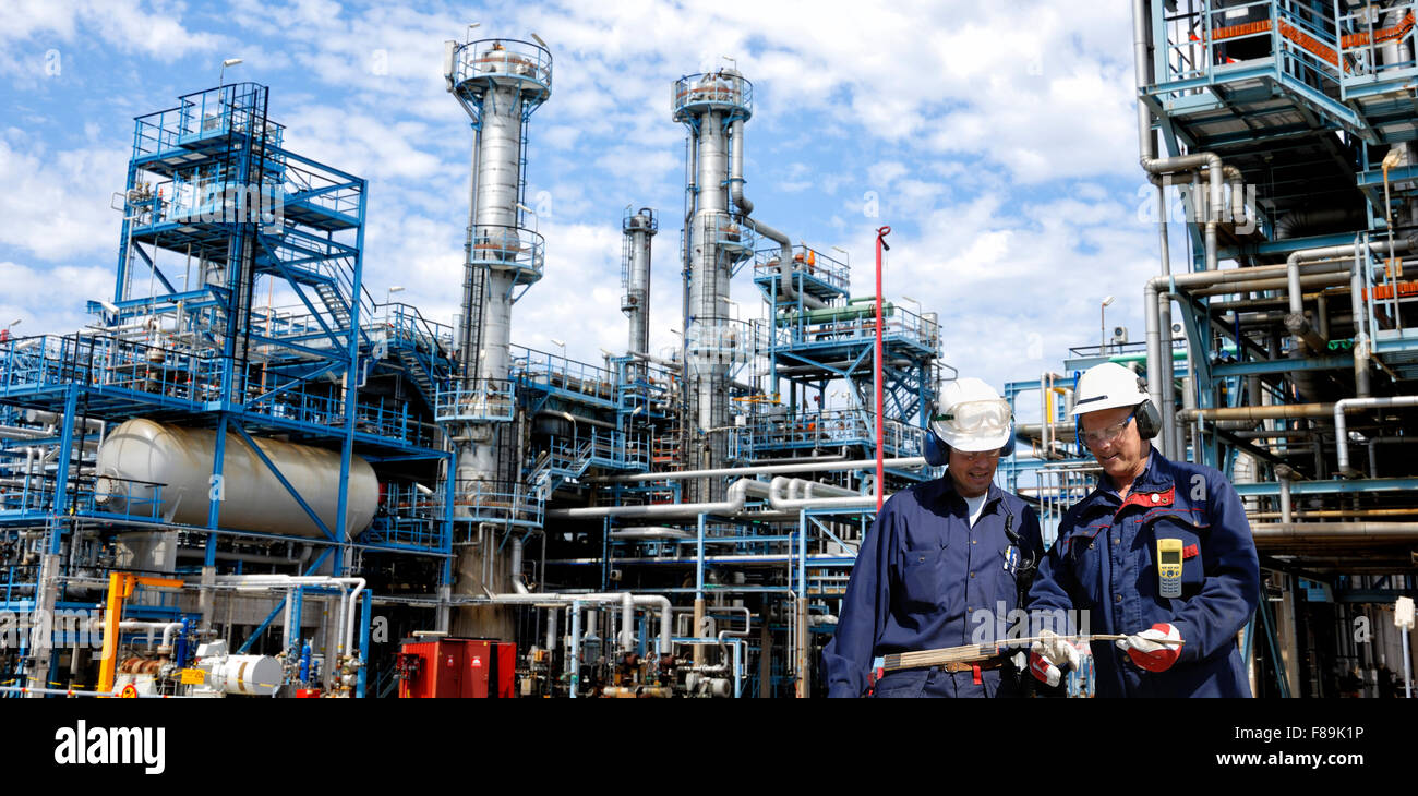 oil and gas workers inside large refinery Stock Photo - Alamy