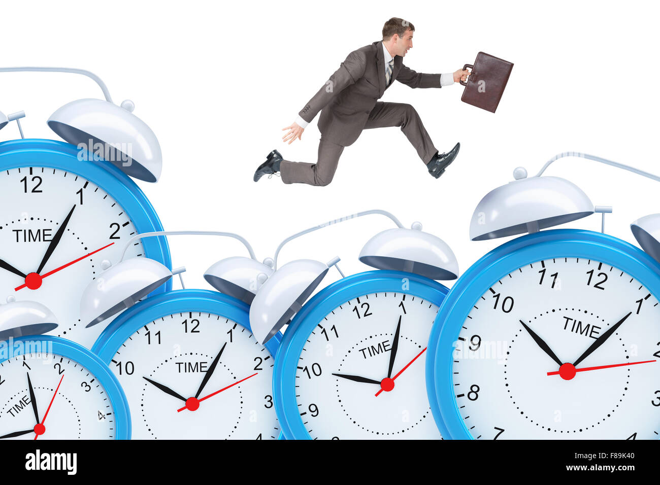 Businessman running with set of alarm clocks Stock Photo - Alamy