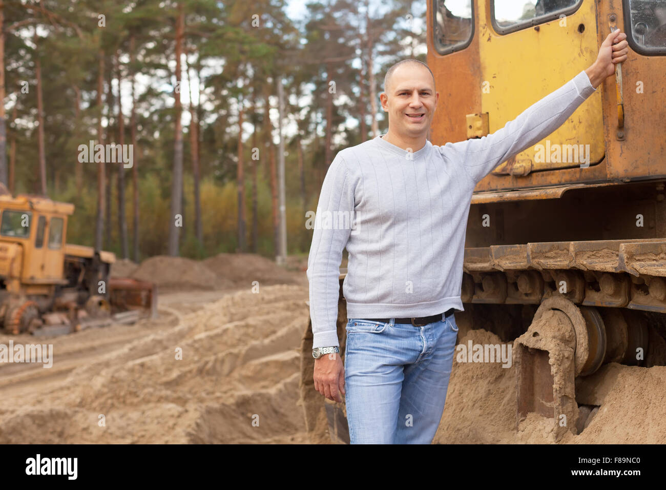Portrait of tractor operator at workplace Stock Photo - Alamy