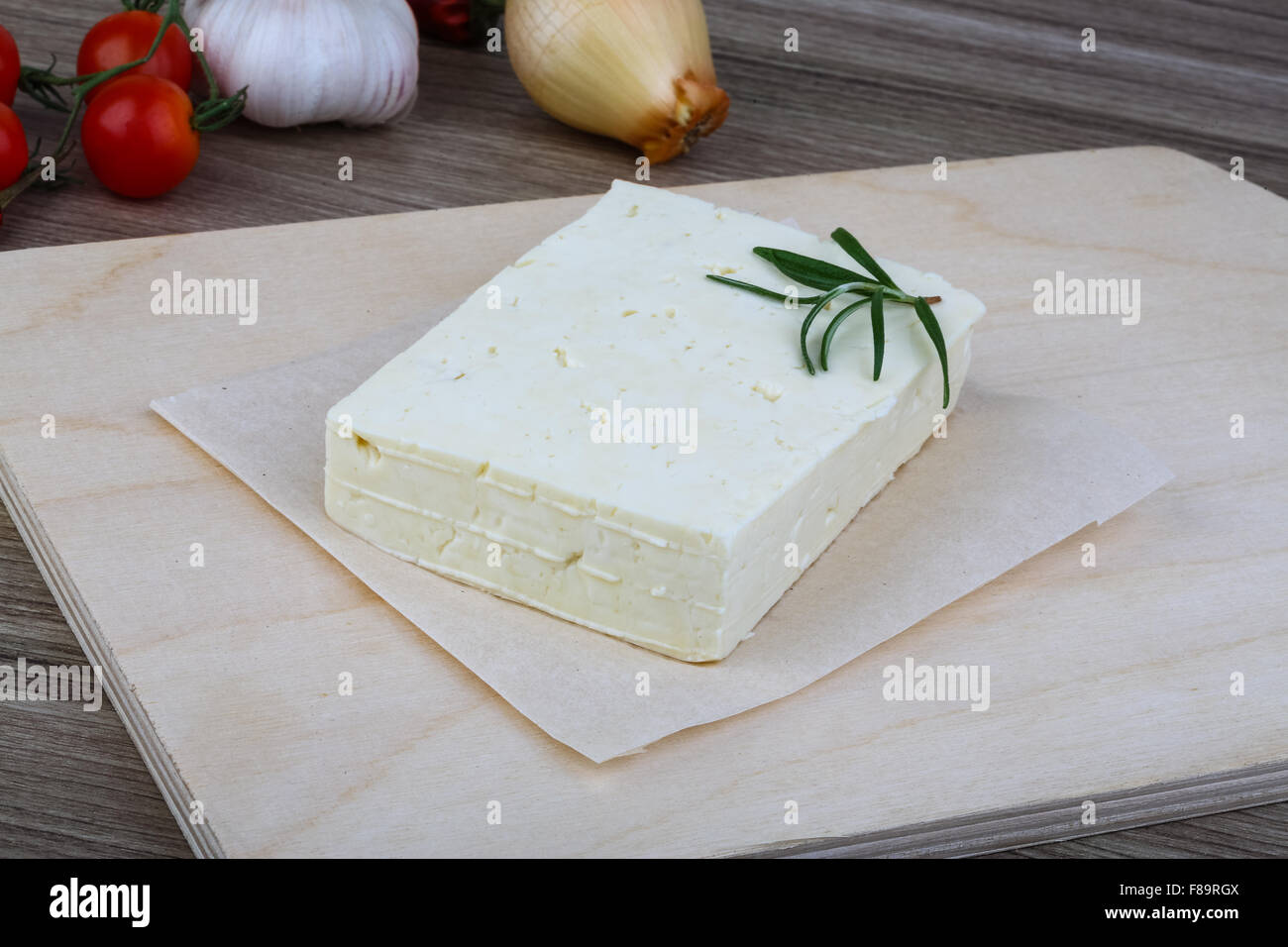 Traditional Caucasian homemade Cheese Brinza with rosemary on wood ...