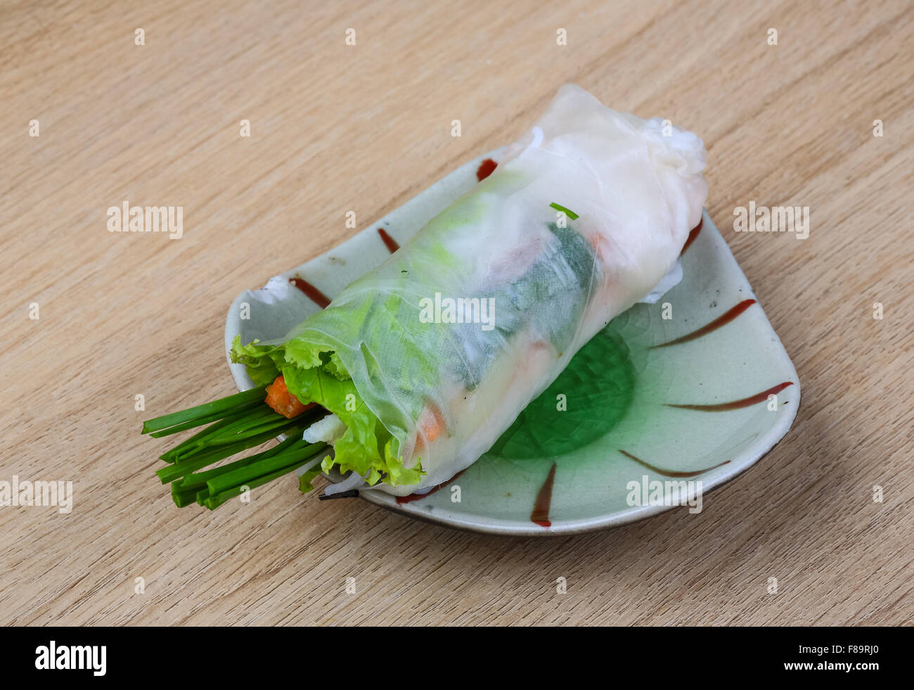 Asian traditional spring rolls on the wood background Stock Photo - Alamy