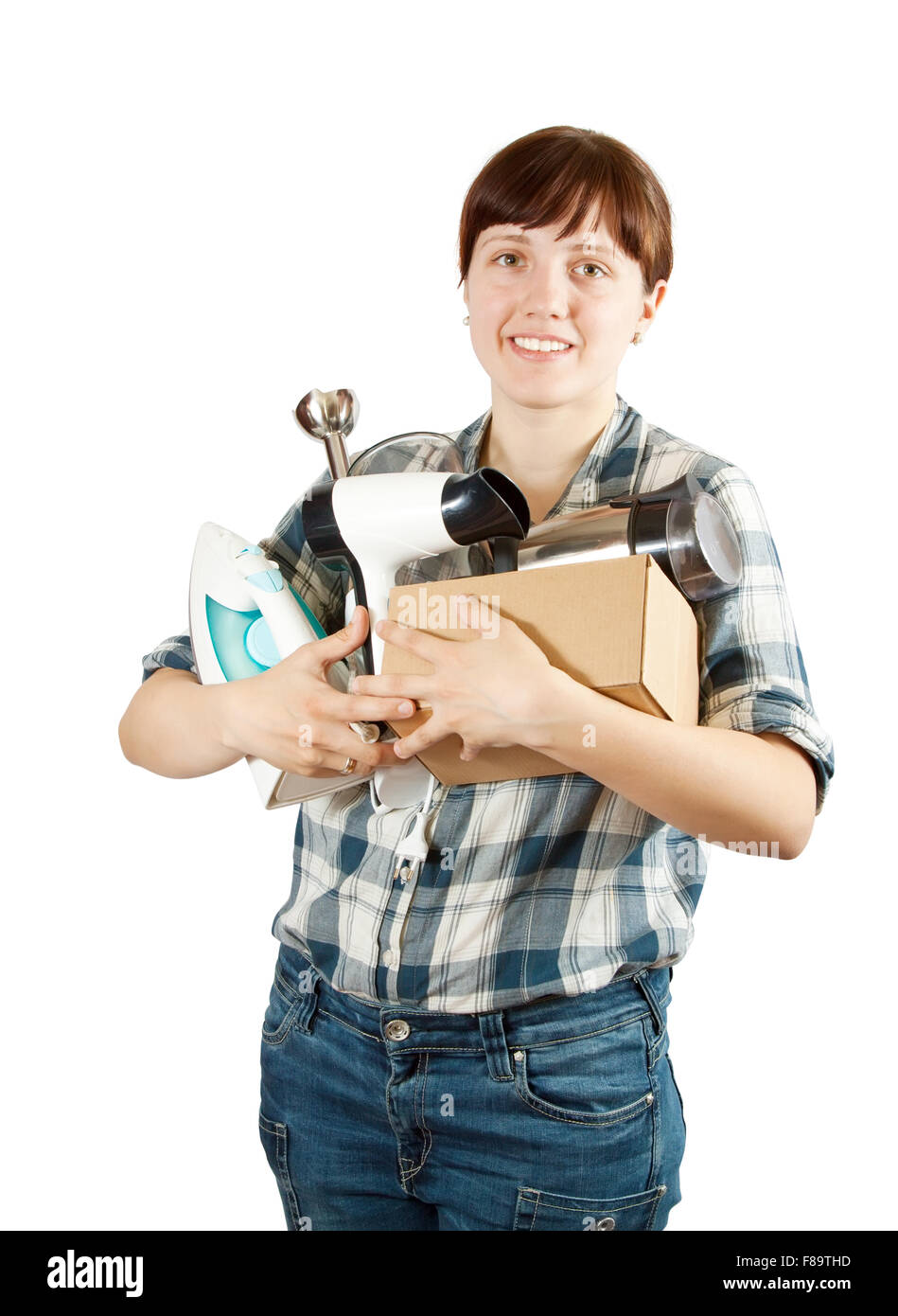young woman with heavy-handed of household appliances over white Stock ...