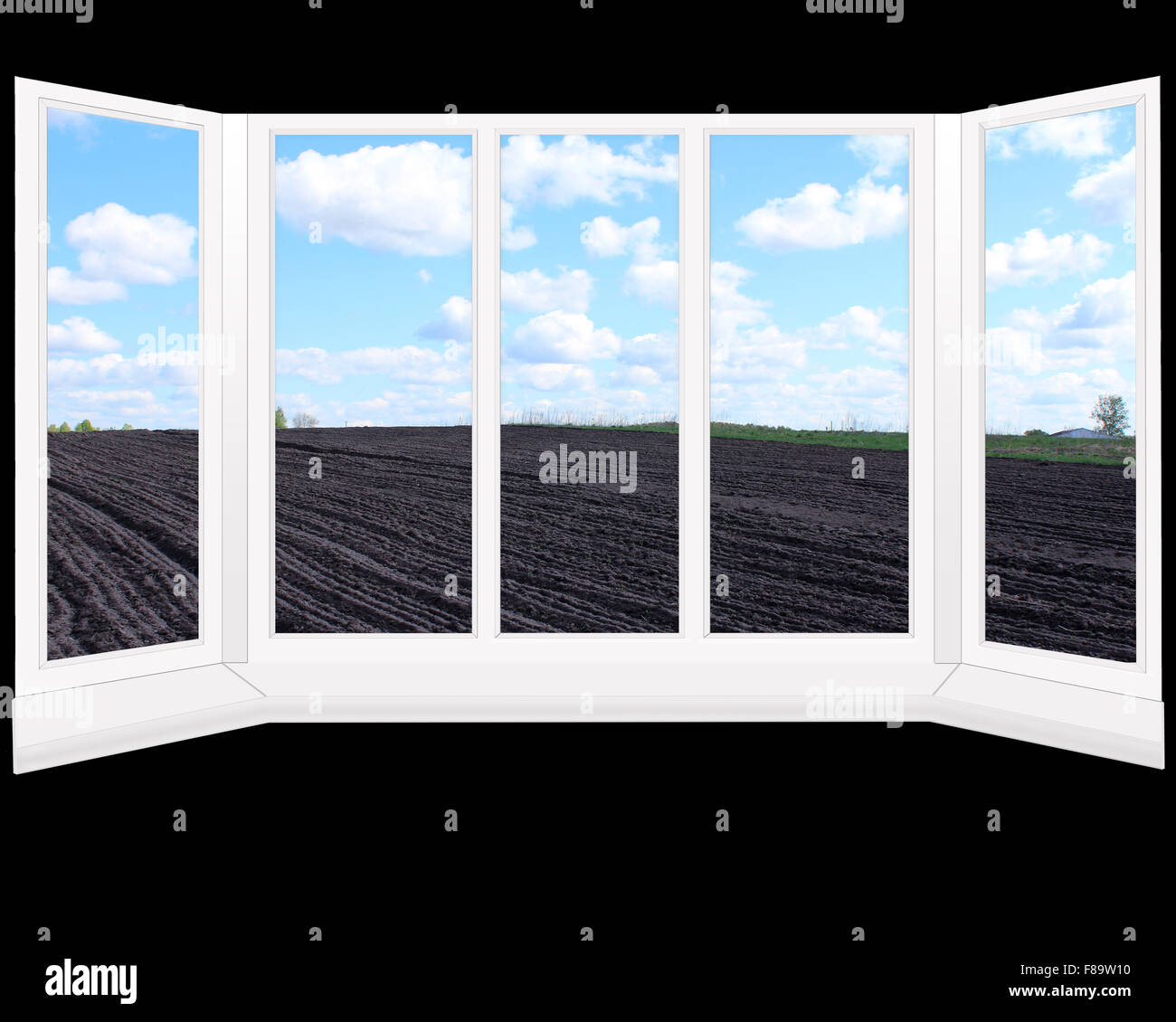 plastic windows overlooking plowed land ready for planting in the ...