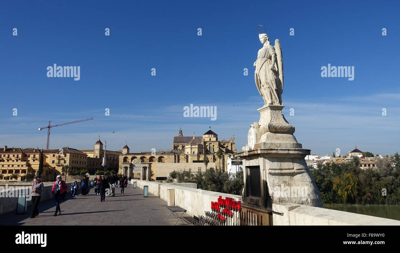 Statue of St. Raphael on the Roman bridge in Cordoba Spain Stock Photo ...