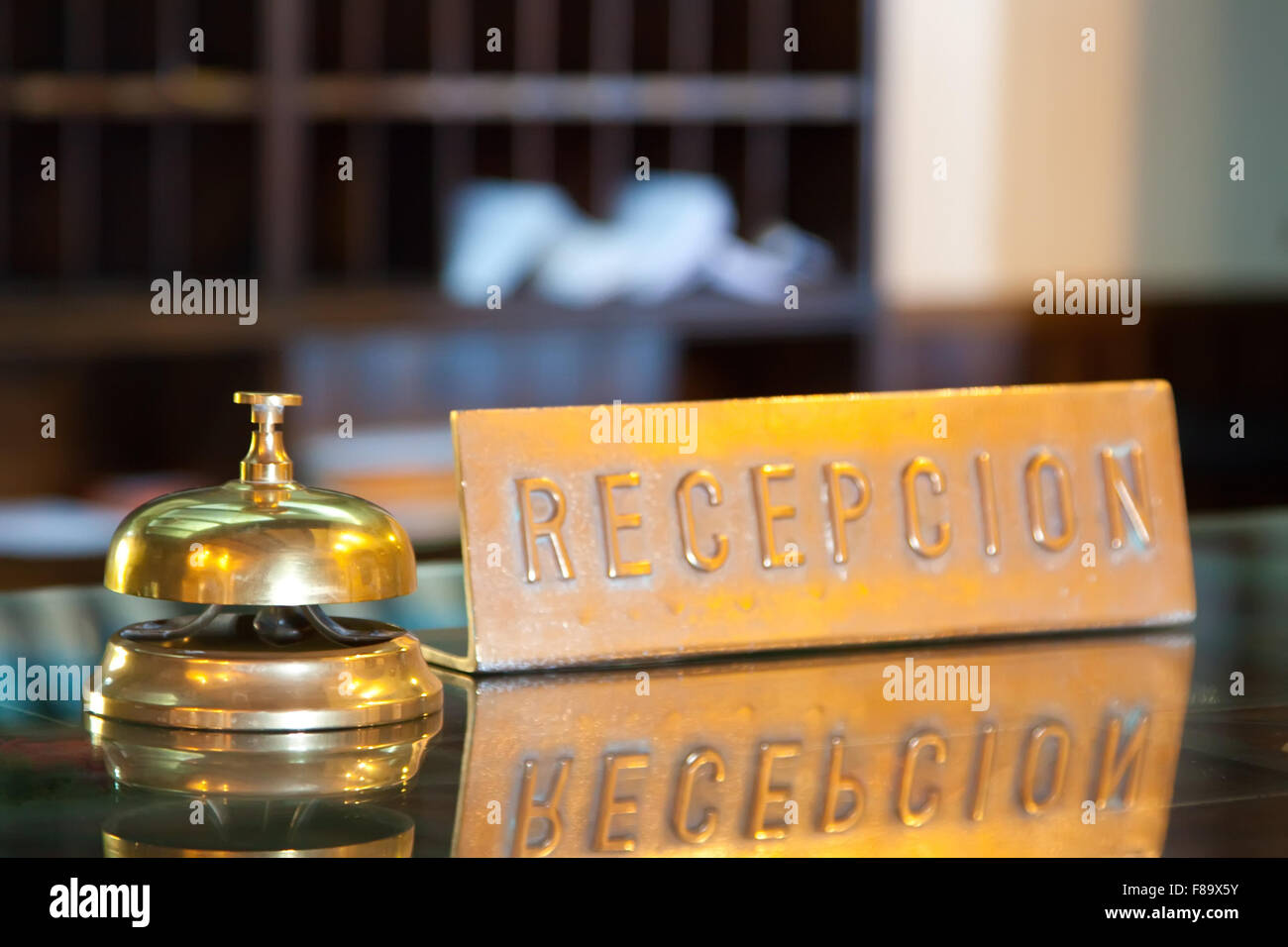 Golden bell on reception desk in hotel Stock Photo - Alamy