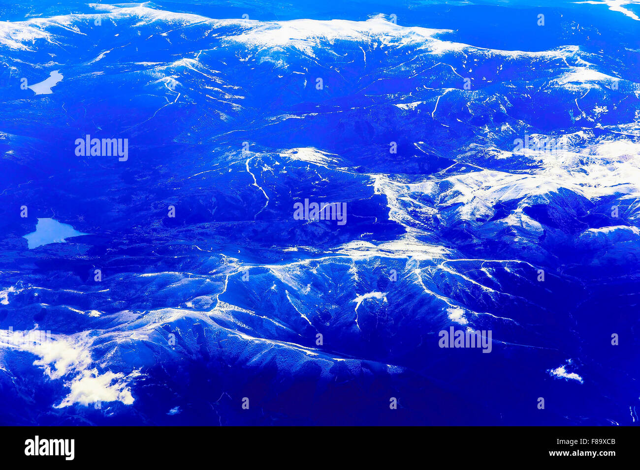 Rocky Mountains Aerial View with Snow on Peak from Jet Stock Photo - Alamy