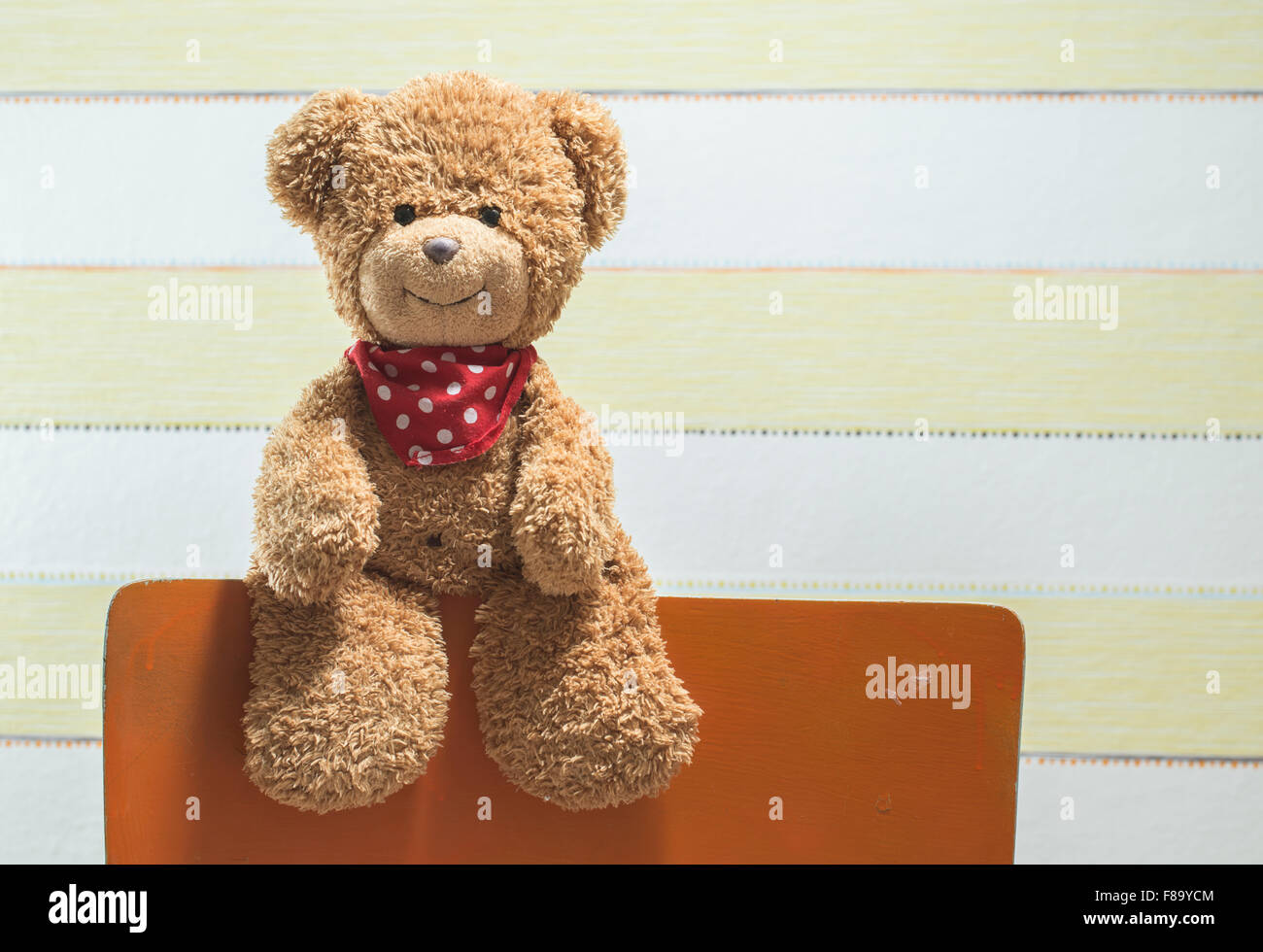 Teddy bear sitting on a chair hi-res stock photography and images - Alamy