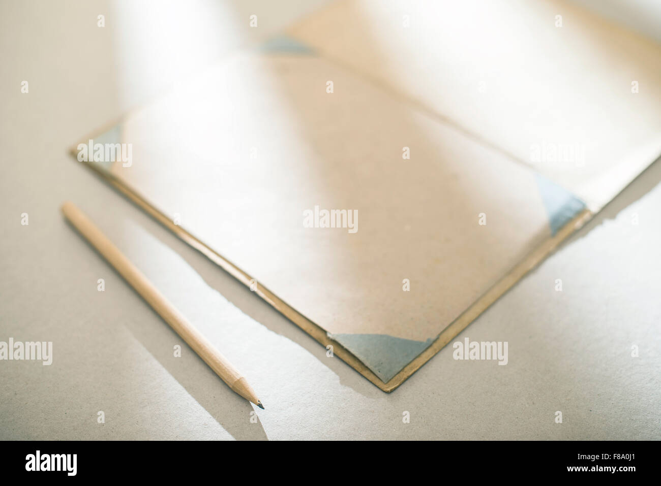 Vintage pencil and drawing paper. Weak sunlight Stock Photo - Alamy