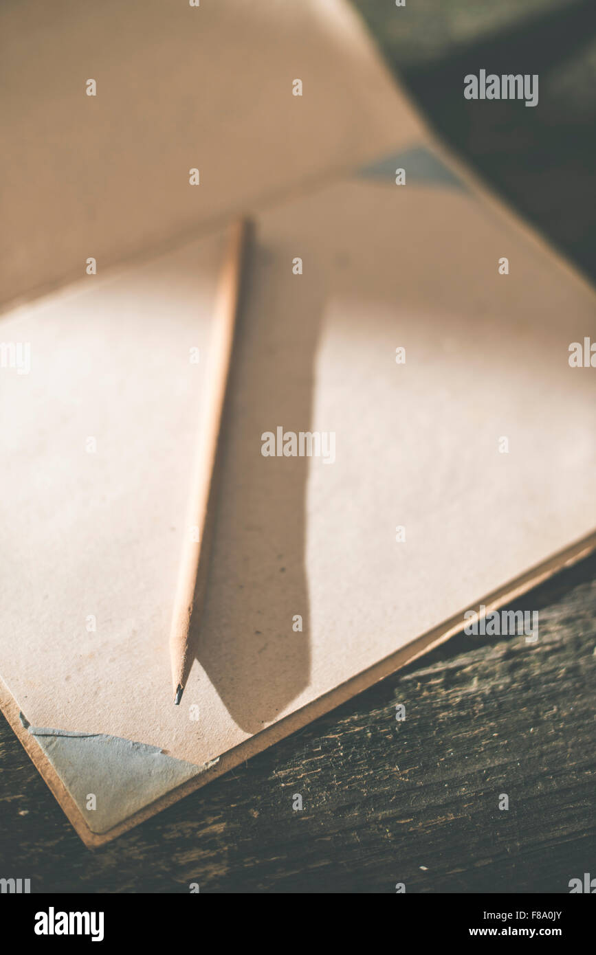 Vintage pencil and drawing paper. Weak sunlight Stock Photo - Alamy
