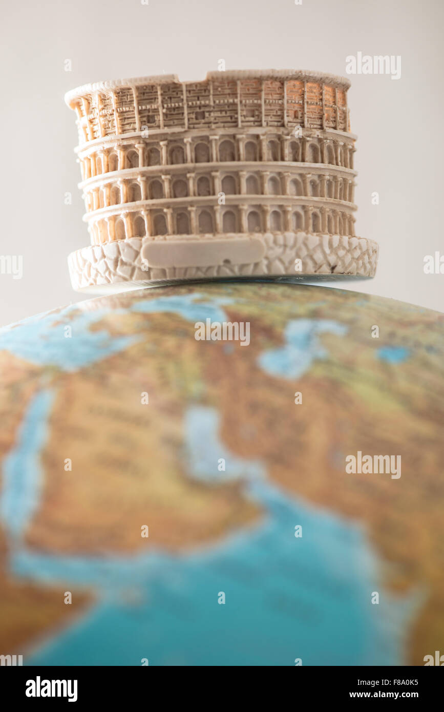 Coliseum of Rome on globe. Miniature concept Stock Photo - Alamy
