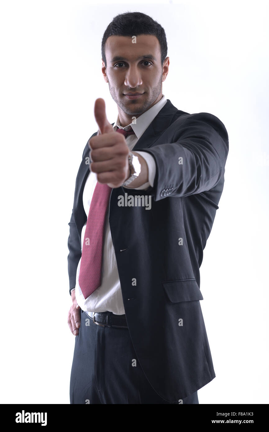 Businessmen making his thumb up saying OK sign symbol isolated on white ...