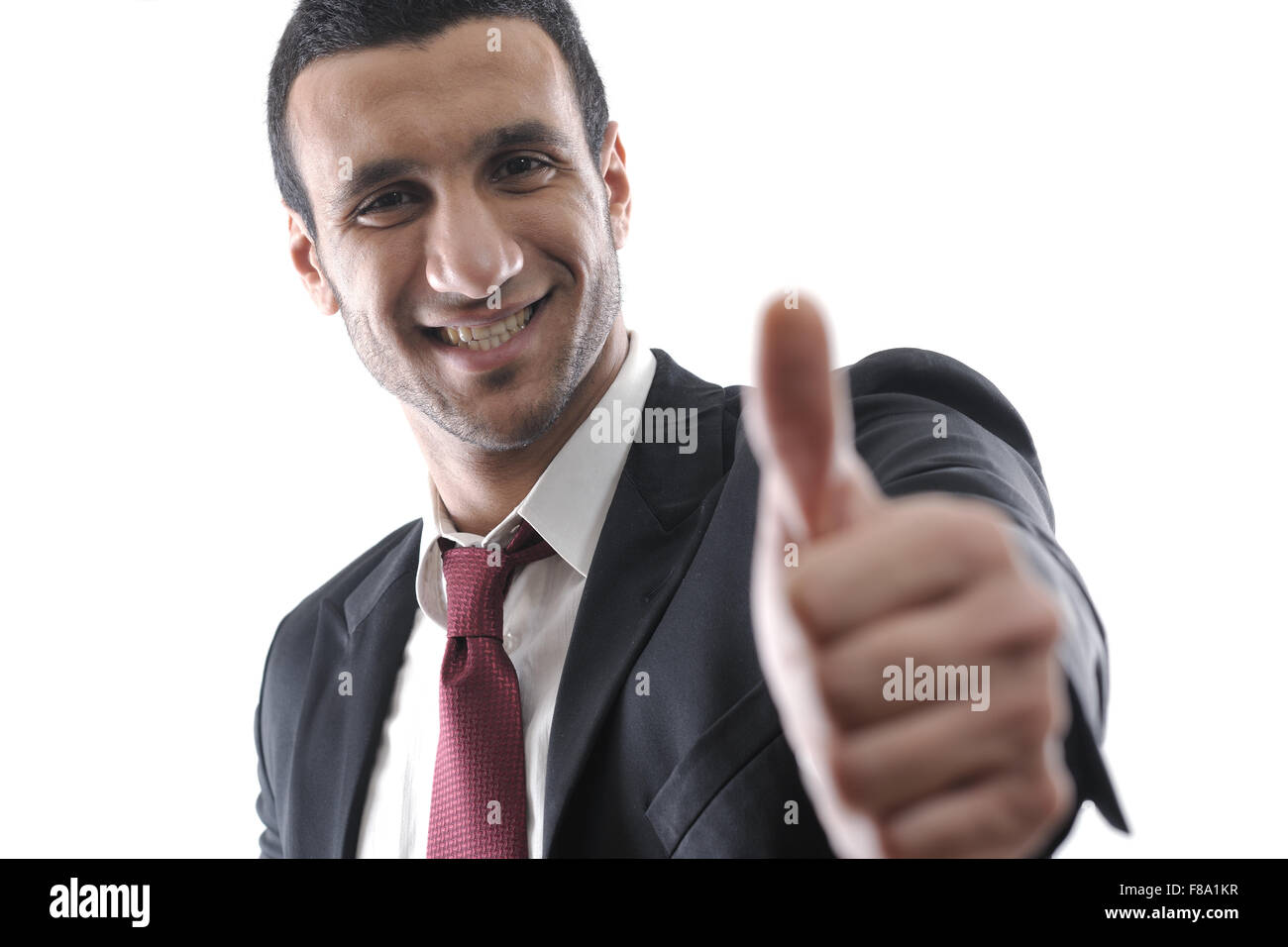 Businessmen making his thumb up saying OK sign symbol isolated on white ...