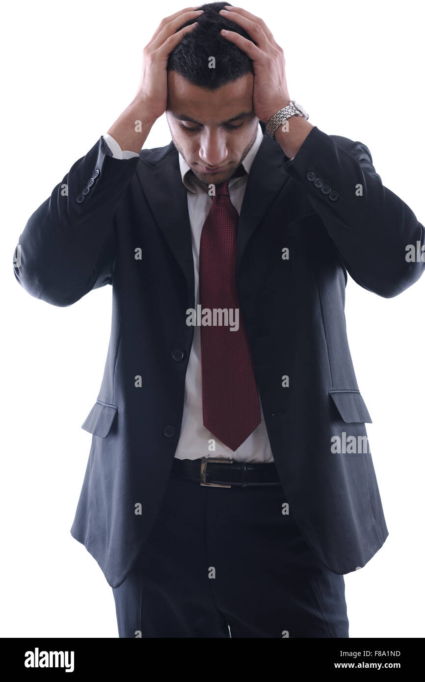 Portrait of a young business man looking depressed from work isolated ...