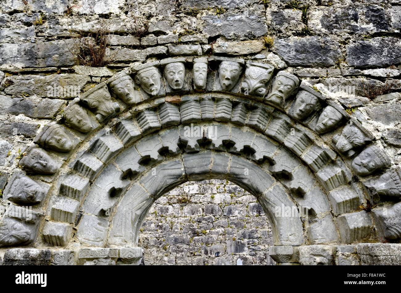 Romanesque doorway at Dysert church surrounded by an order of 12 human ...