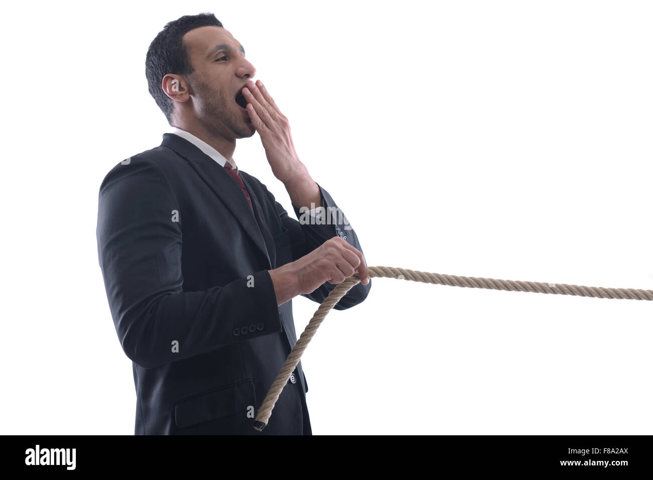 Business man pulling and bond tied with rope concept isolated on white ...