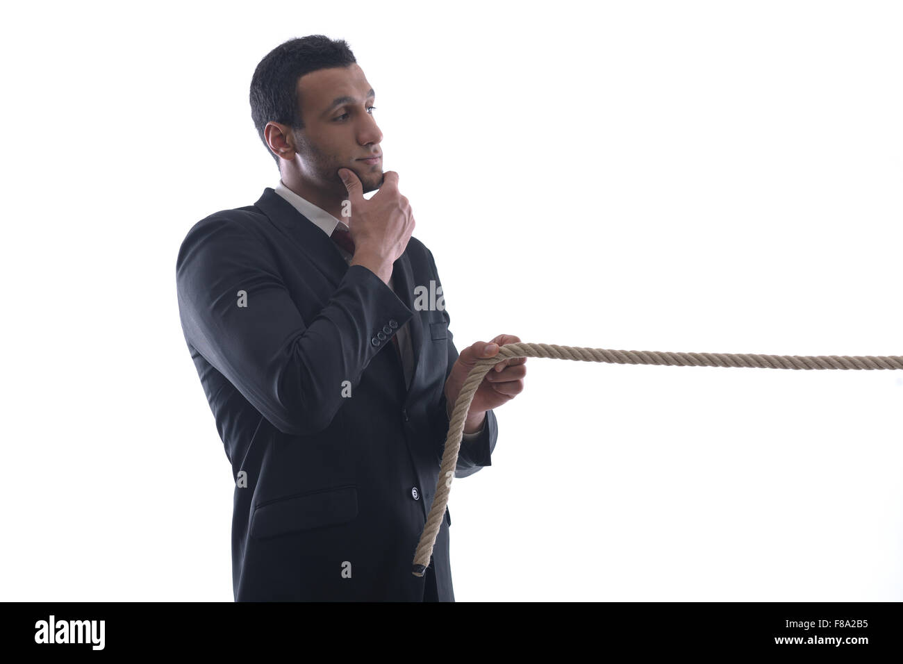 Business man pulling and bond tied with rope concept isolated on white ...