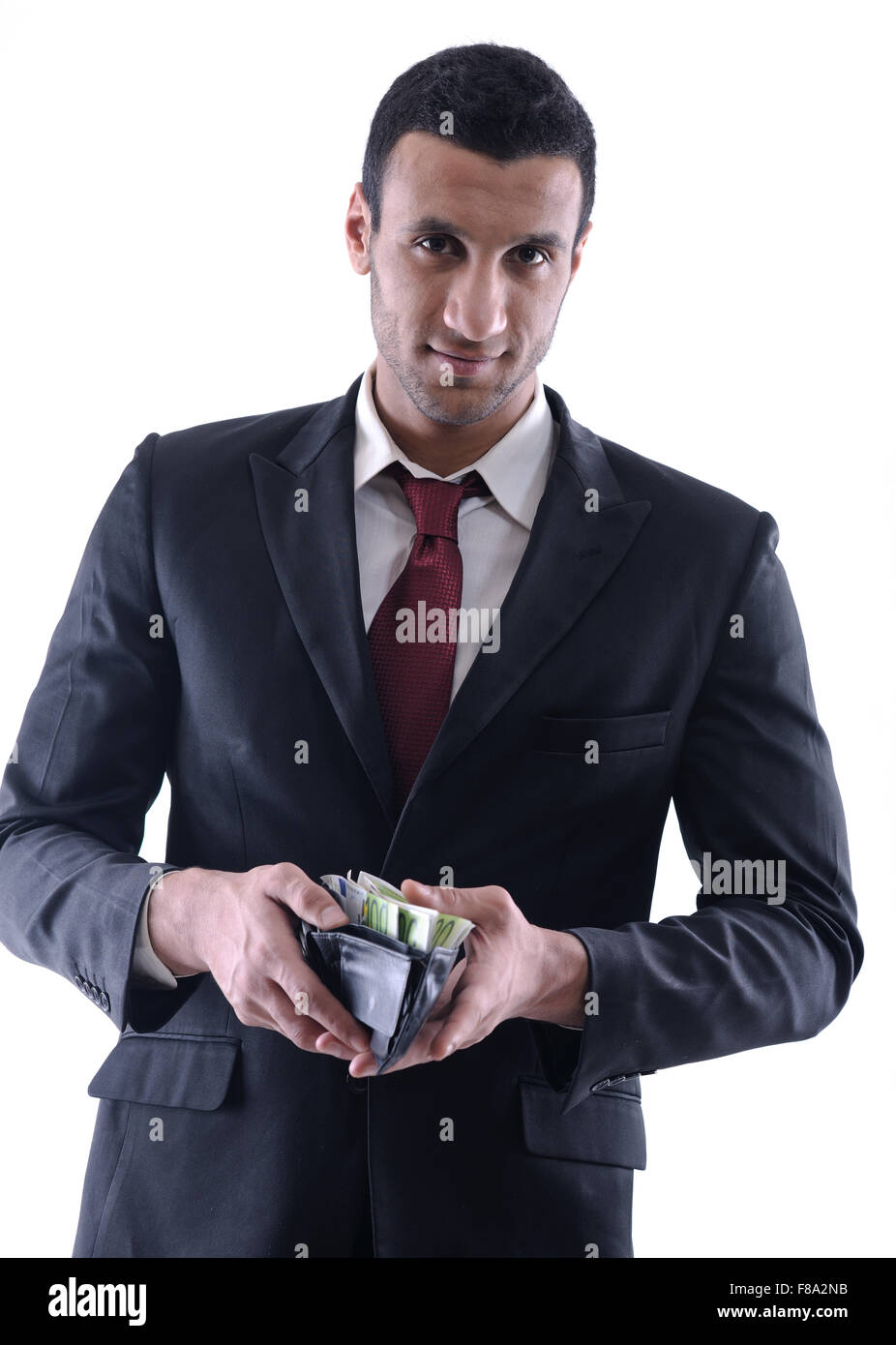 Portrait of a business man holding and catch falling money bills ...