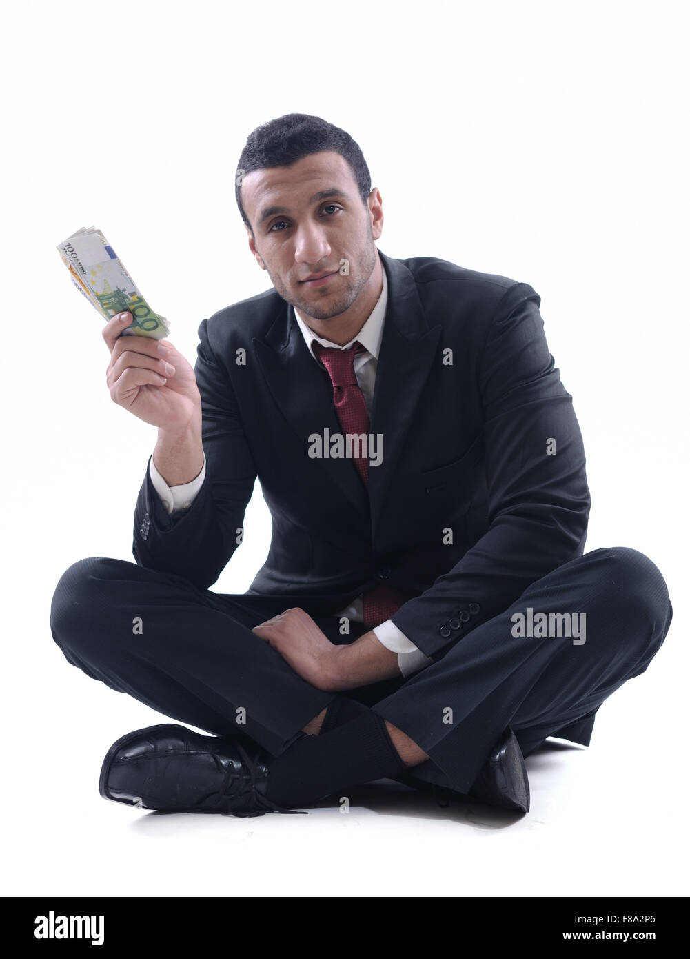 Portrait of a business man holding and catch falling money bills ...