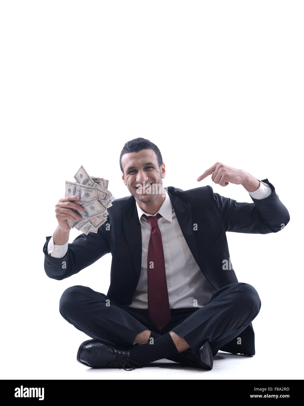 Portrait of a business man holding and catch falling money bills ...