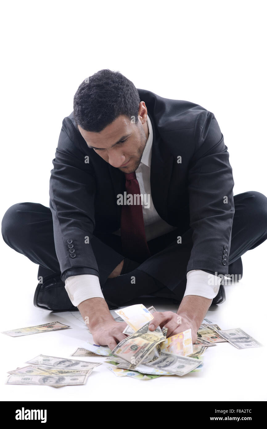 Portrait of a business man holding and catch falling money bills ...