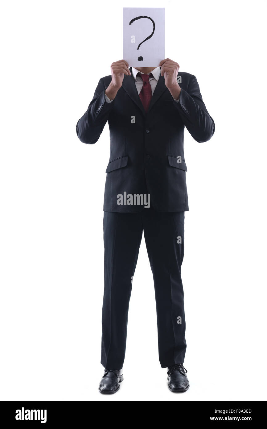 Business man holding a piece of paper over his face with a question ...