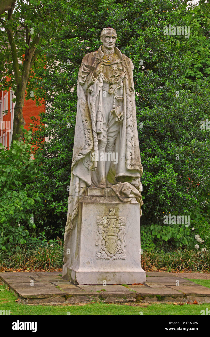 A carved stone monument to a a local benefactor of the town standing in ...