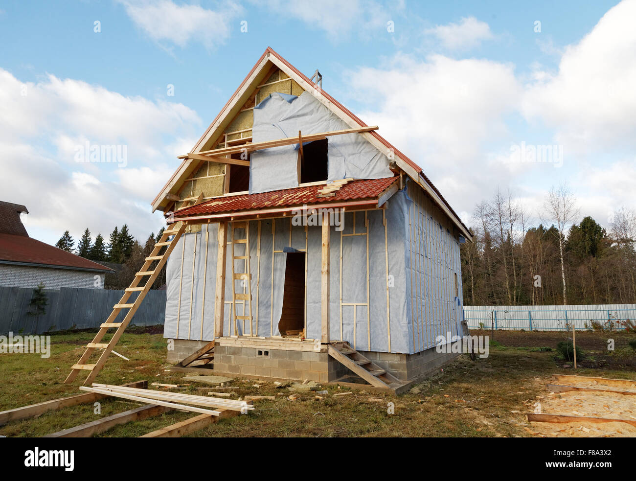 The under construction wooden house autumn Stock Photo - Alamy
