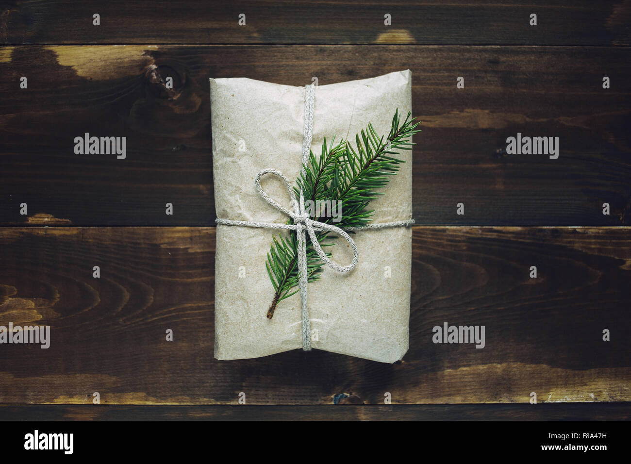 Wrapped gift with fur-tree branch Stock Photo - Alamy