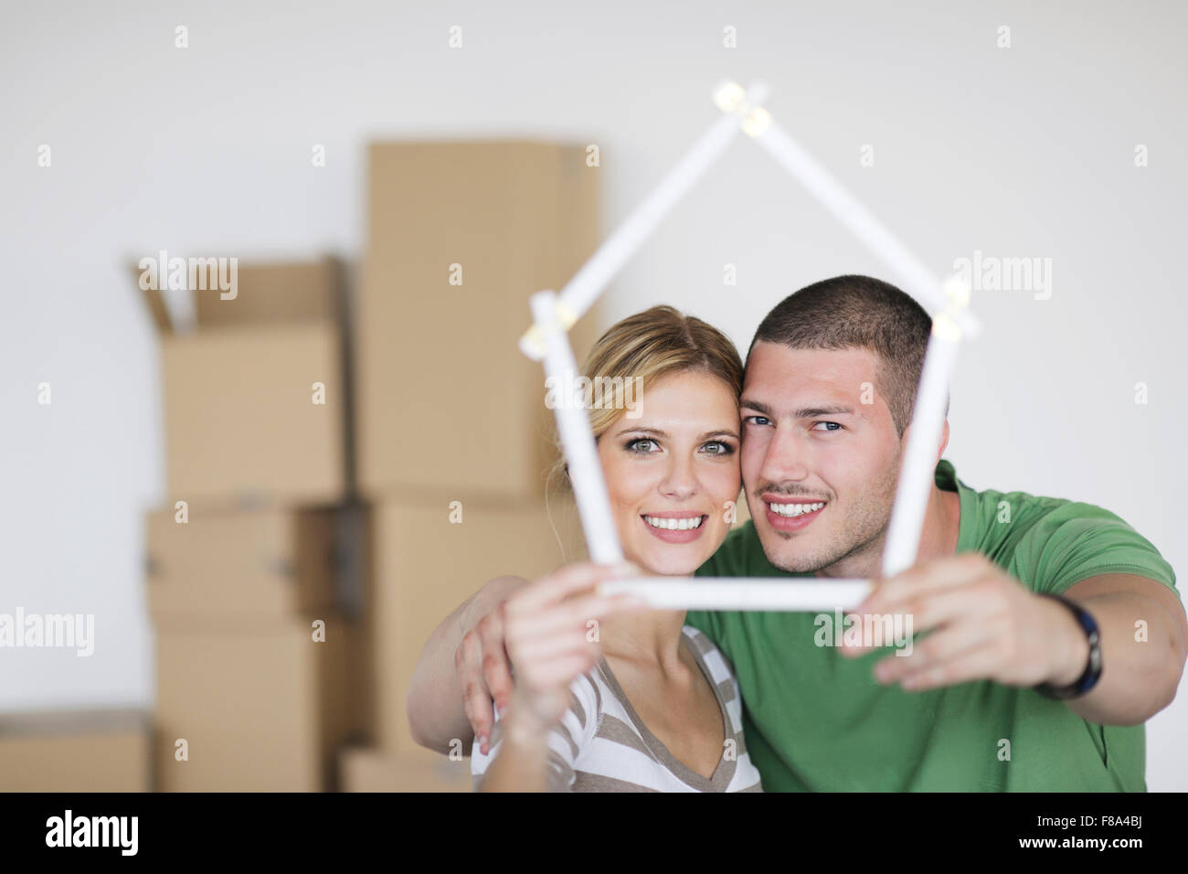 happy Young couple moving in new home Stock Photo - Alamy