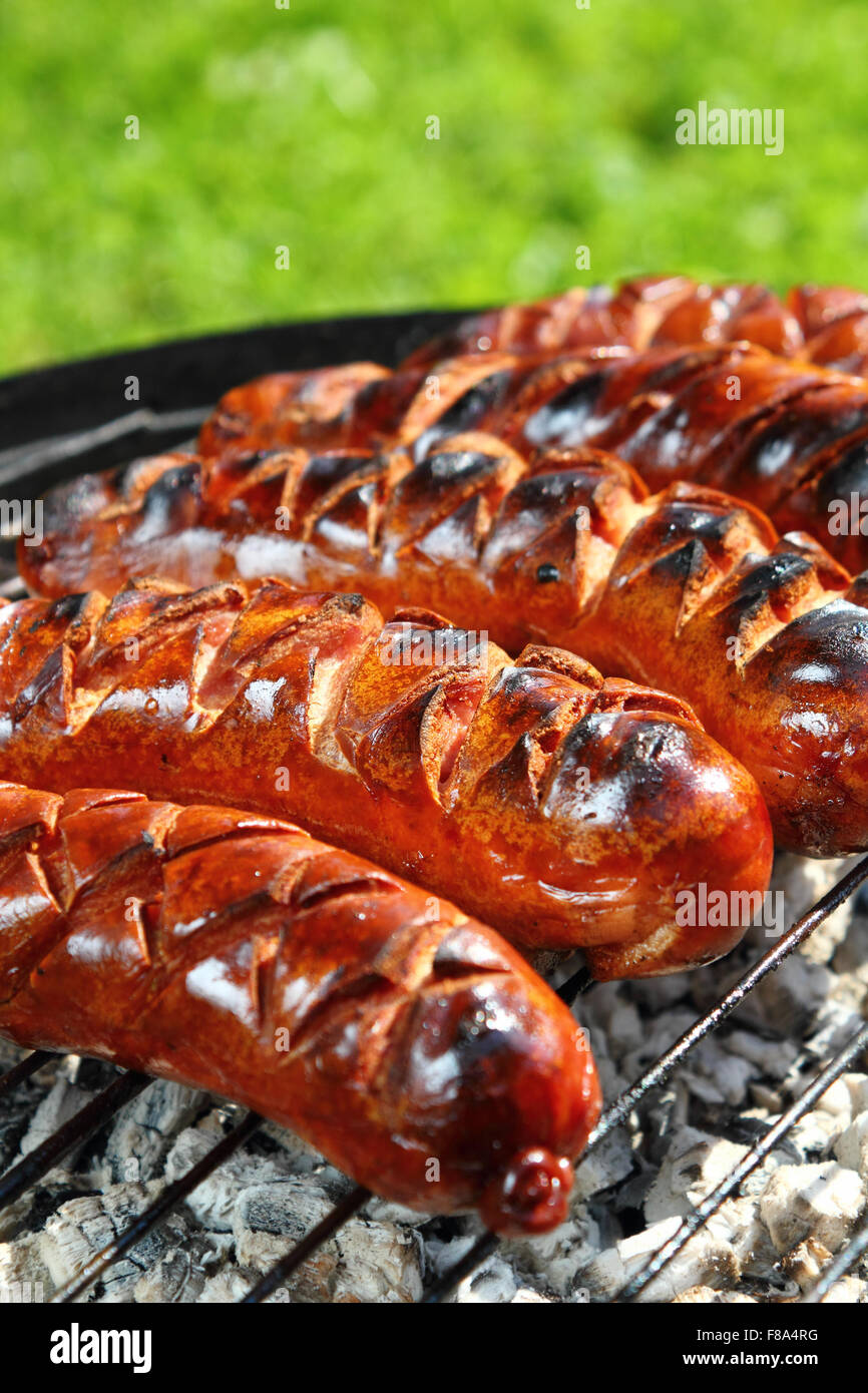 Grilling Sausages on barbecue grill Stock Photo - Alamy