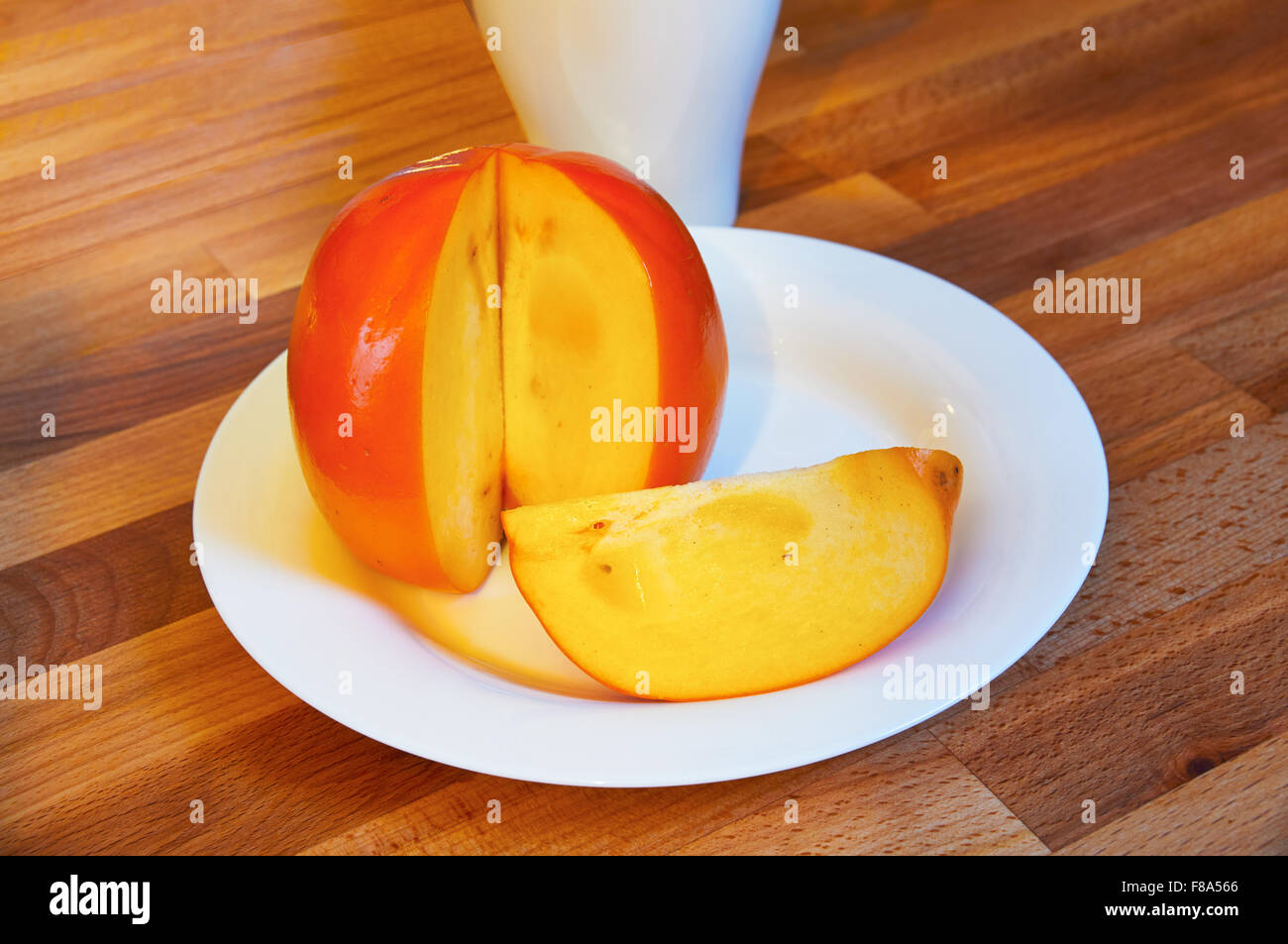 Asian juicy orange persimmon closeup Stock Photo - Alamy