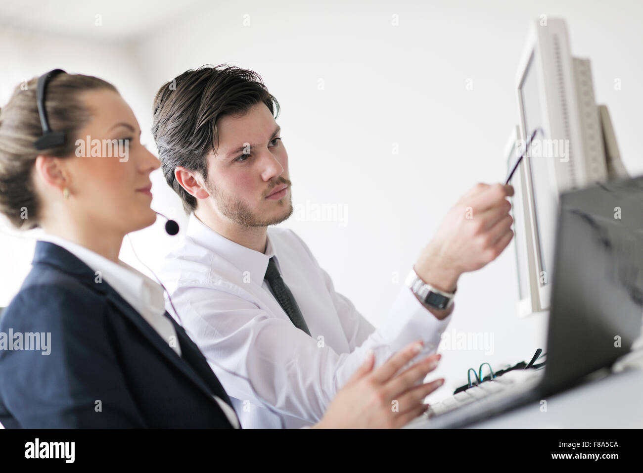 business people group with headphones giving support in help desk ...