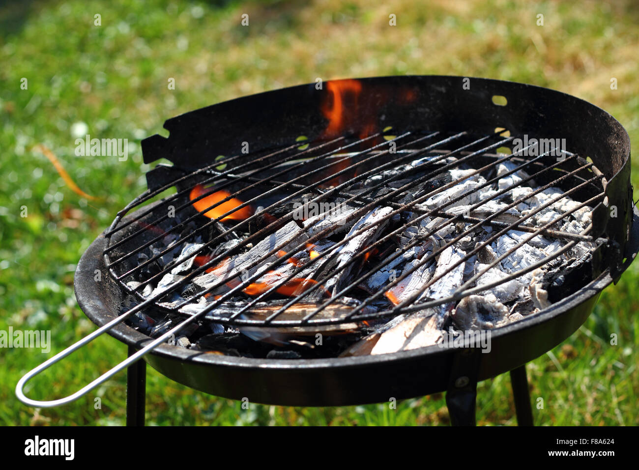 Fire in barbecue grill Stock Photo - Alamy