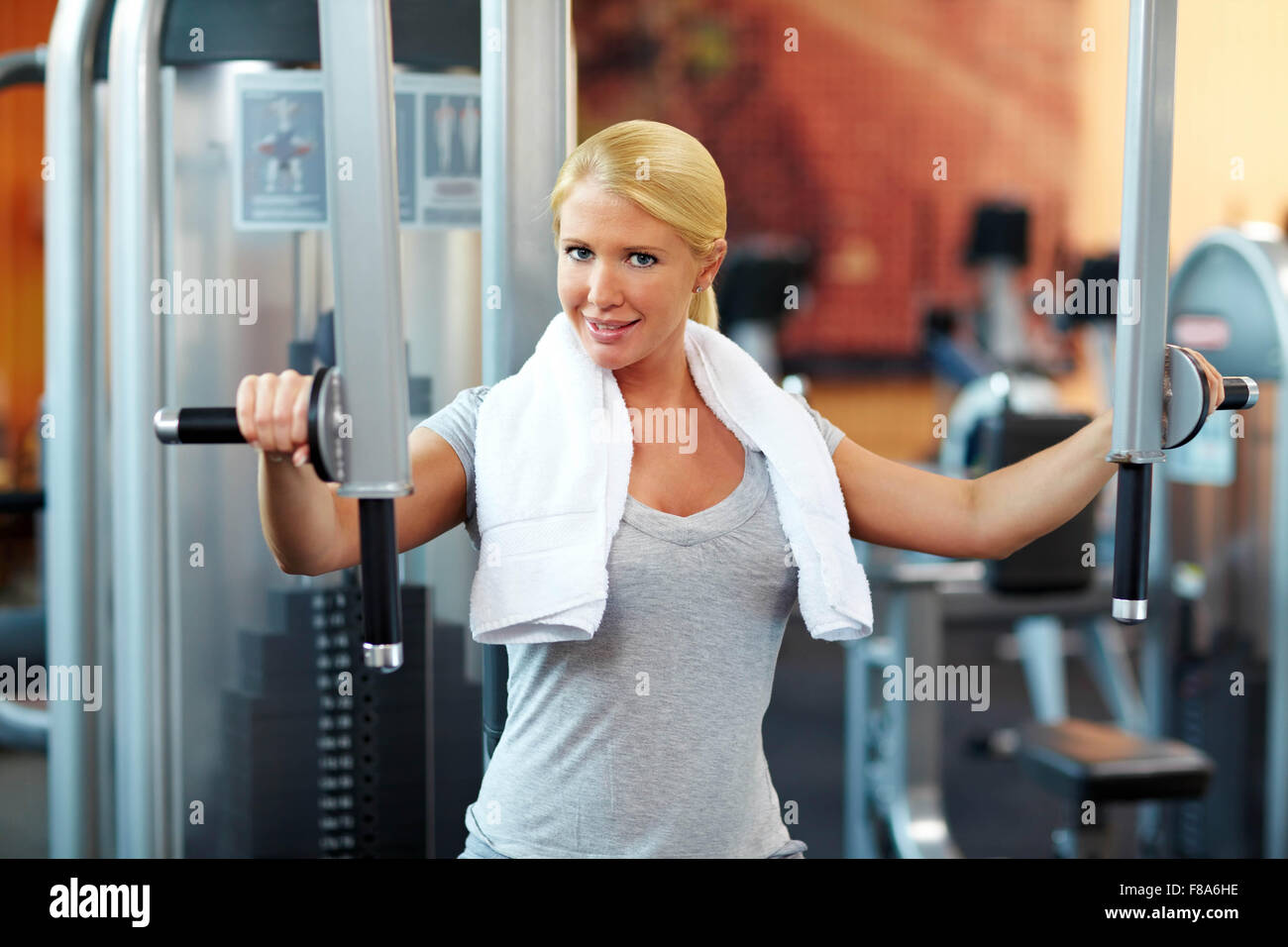 Female hand holding handle on training machine in gym Stock Photo - Alamy