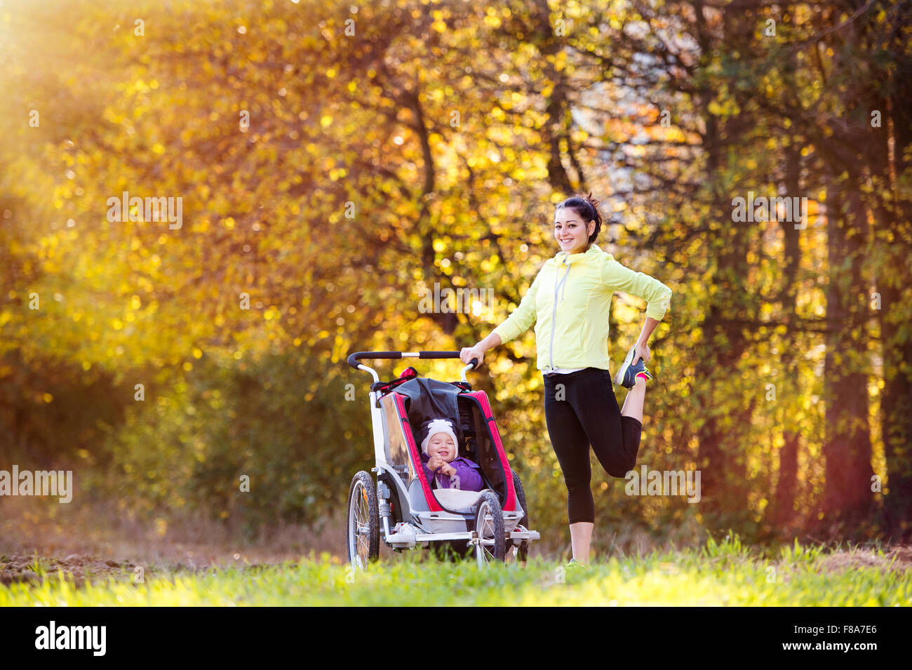 Young mother running Stock Photo - Alamy