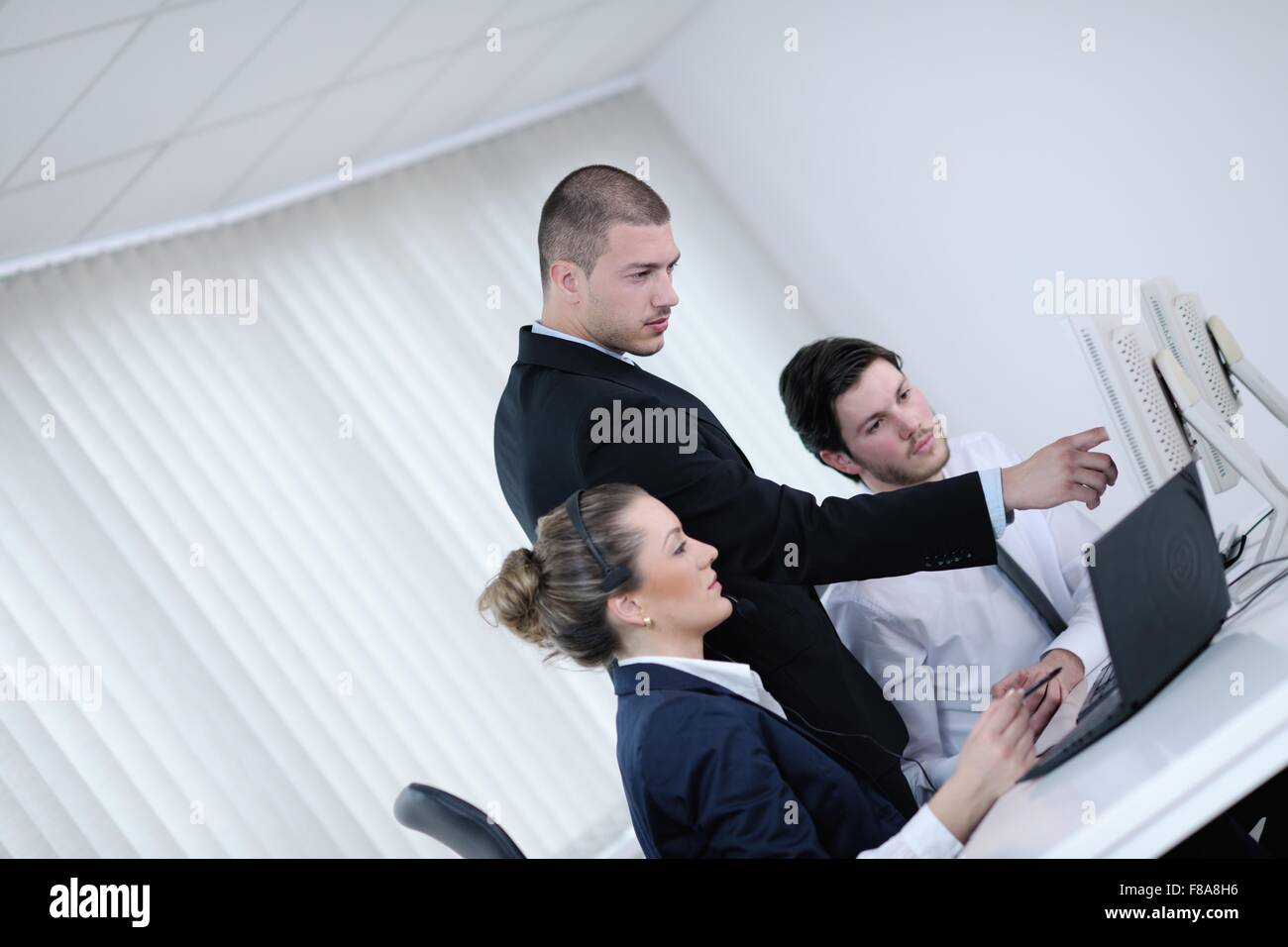 business people group with headphones giving support in help desk ...