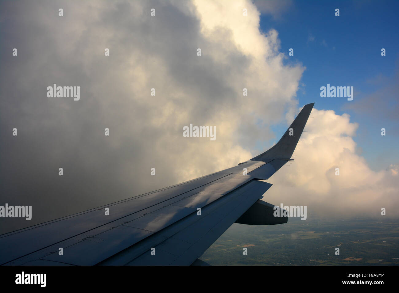 Airplane enters into a cloud Stock Photo - Alamy