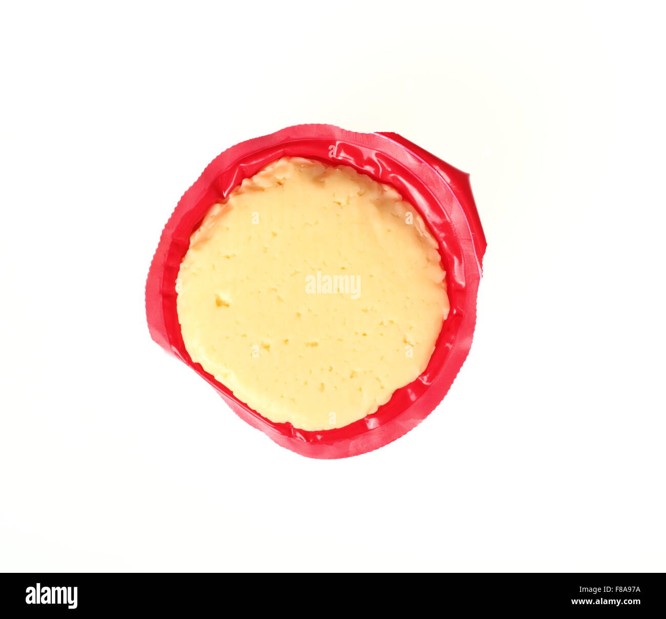 Cheese in red plastic package Stock Photo - Alamy
