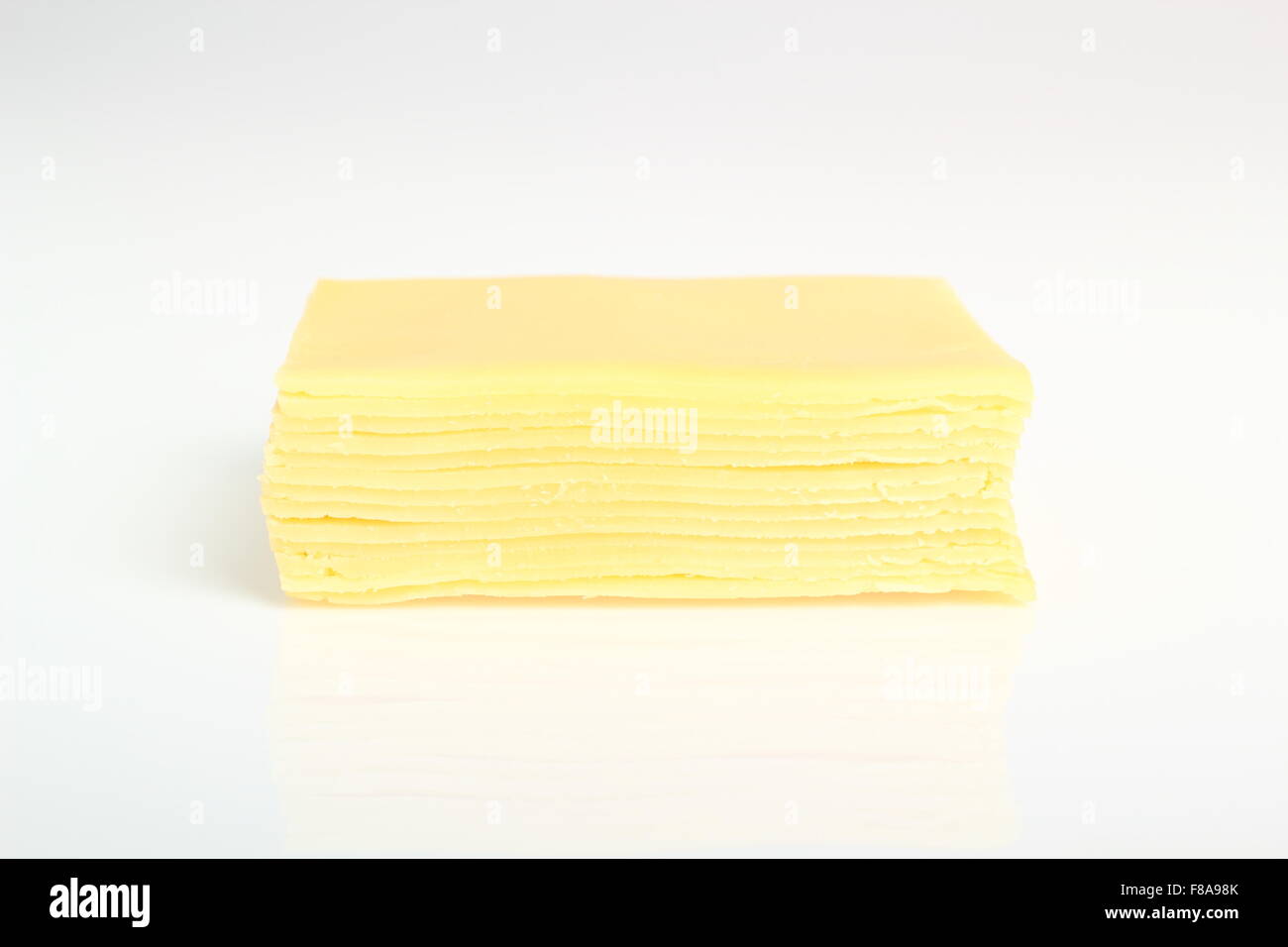 Block of Sliced Cheese Stock Photo - Alamy