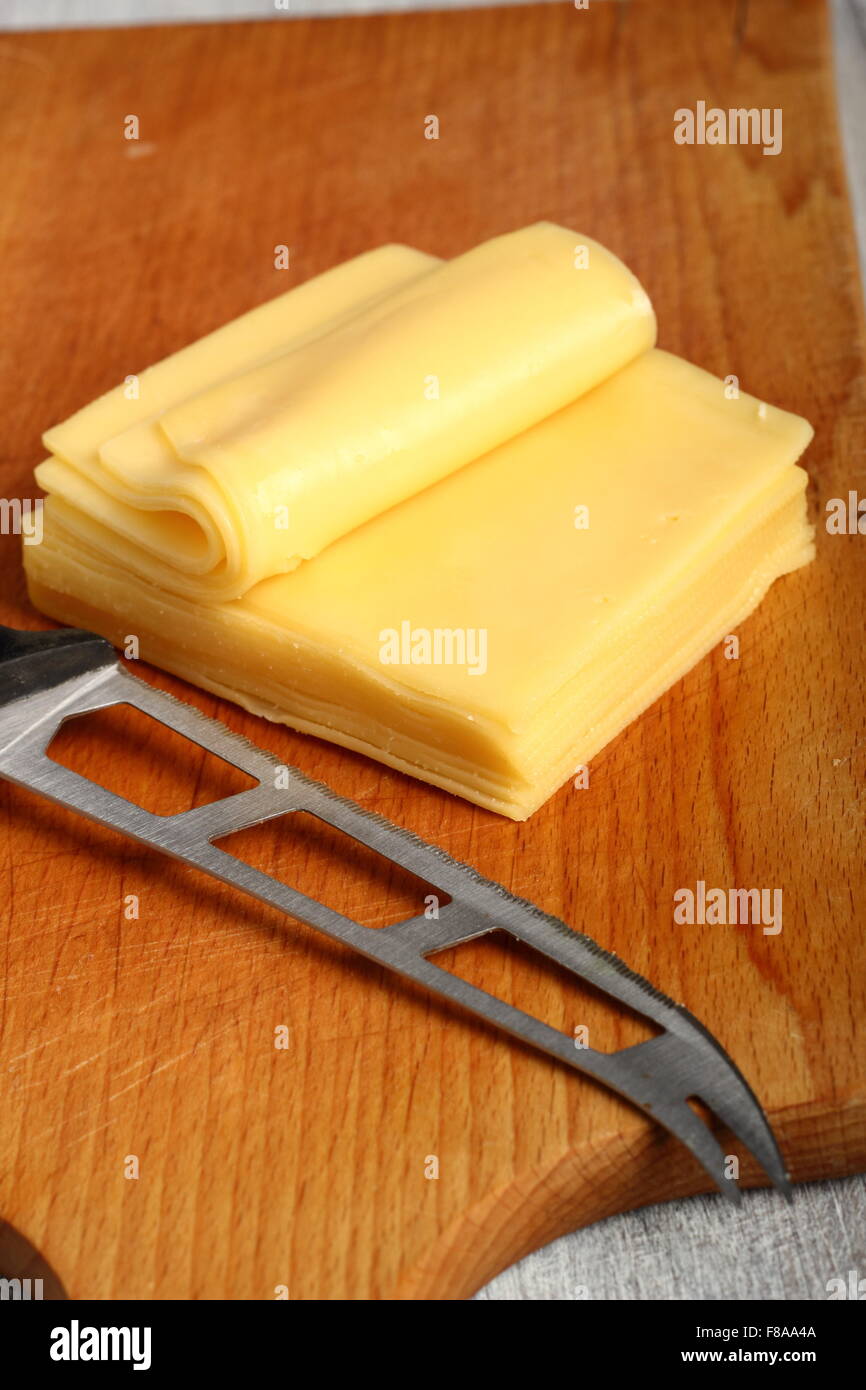 Block of Sliced Cheese Stock Photo - Alamy