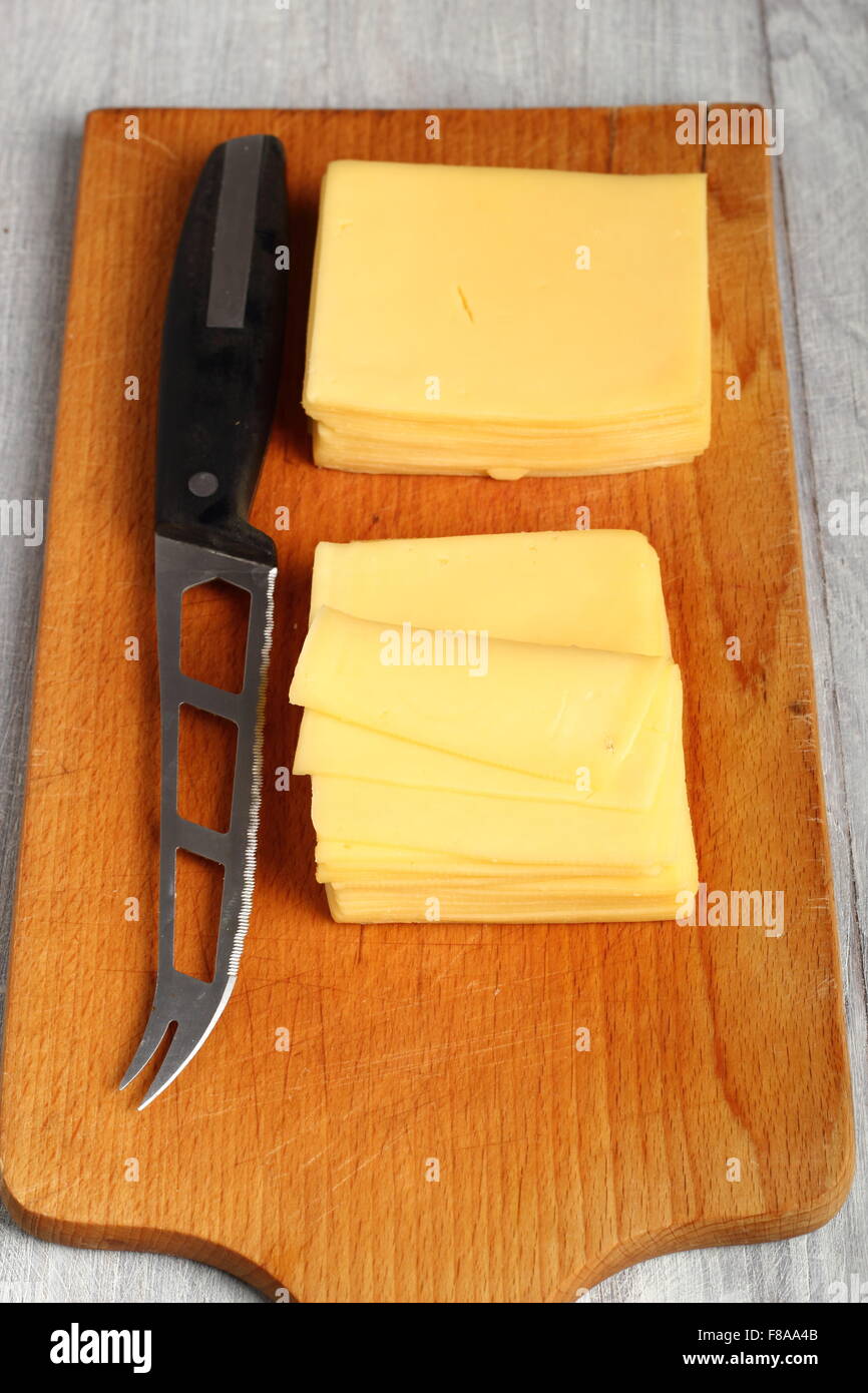 Block of Sliced Cheese Stock Photo - Alamy