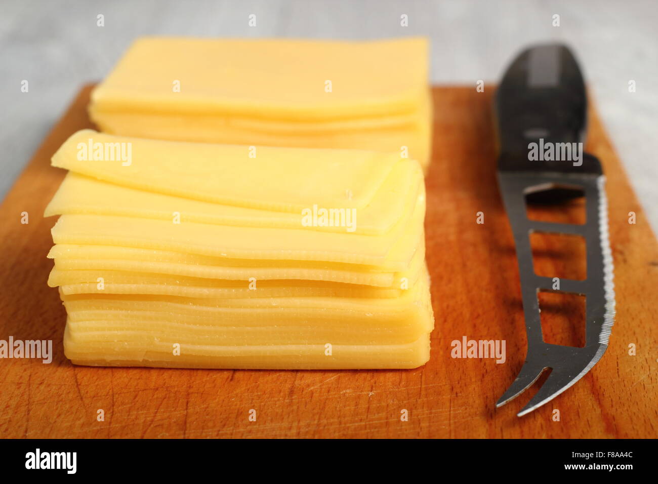 Block of Sliced Cheese Stock Photo - Alamy